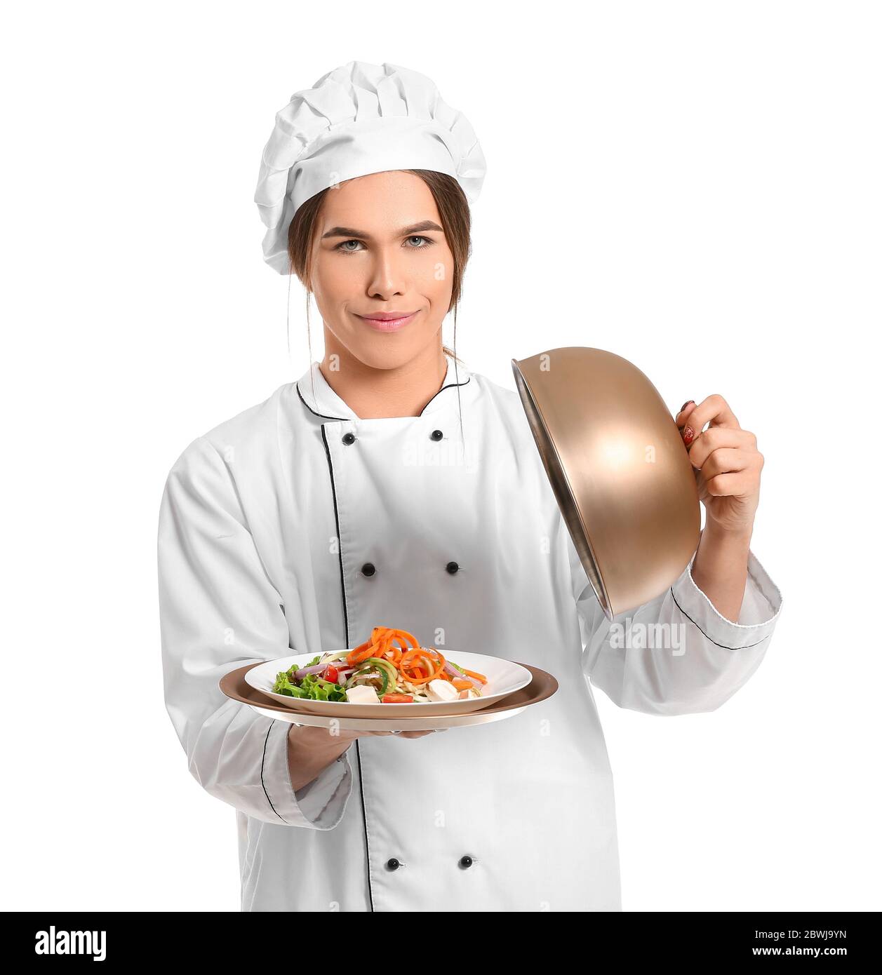Transgender chef with salad on white background Stock Photo - Alamy