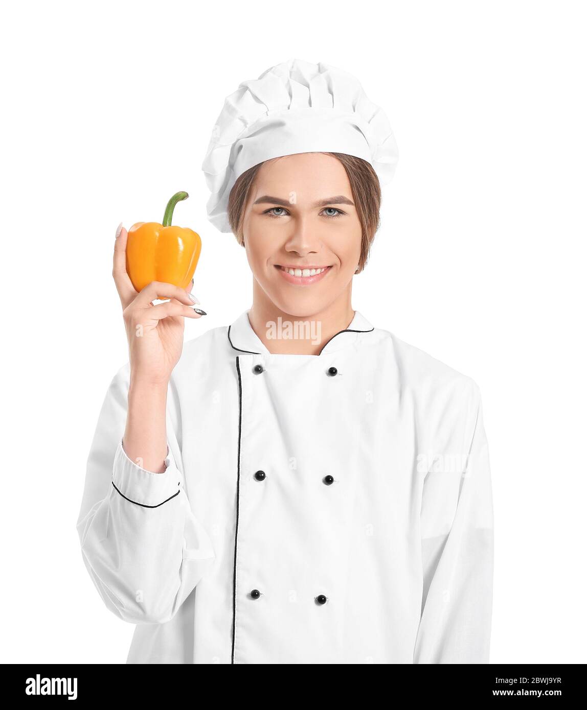 Transgender chef with bell pepper on white background Stock Photo - Alamy