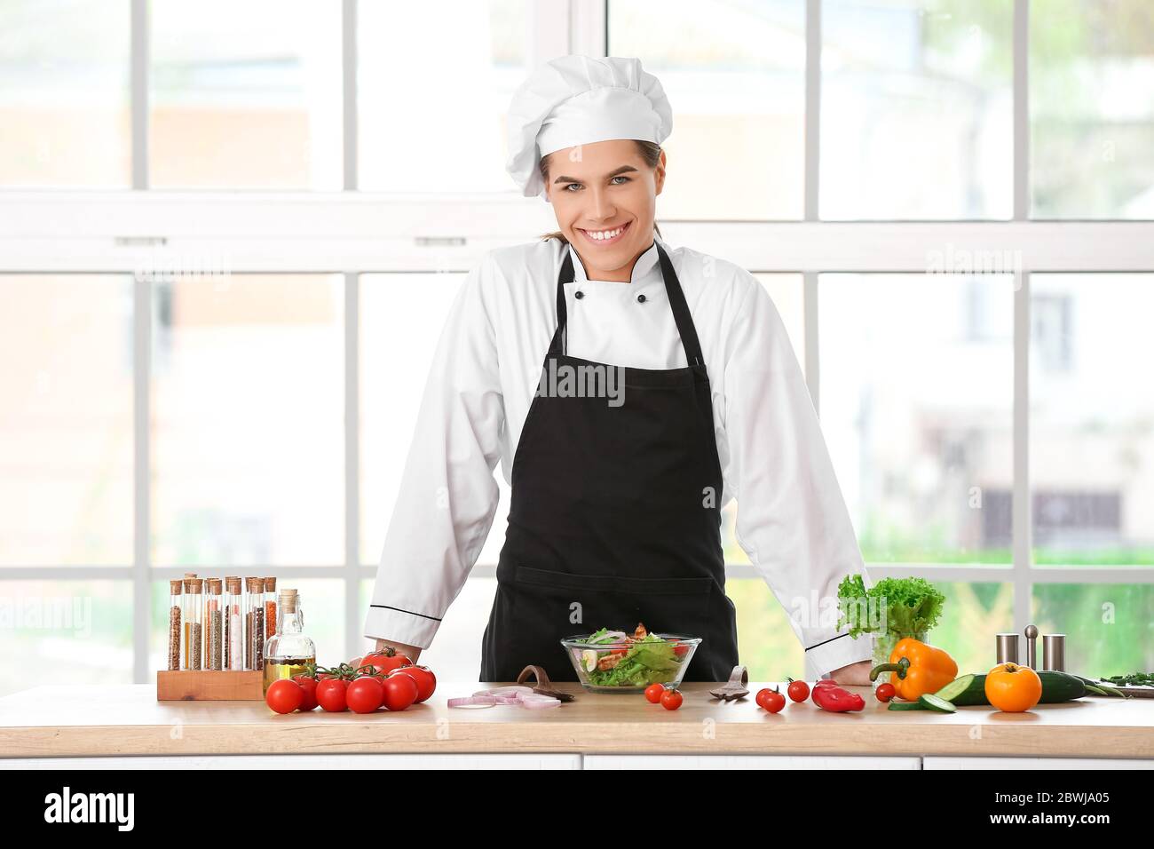 Transgender chef making salad in kitchen Stock Photo - Alamy