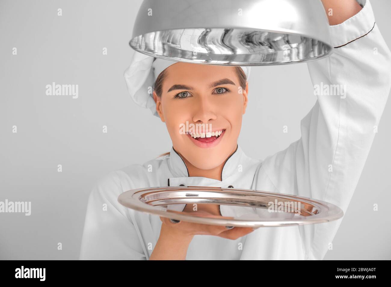 Transgender chef on light background Stock Photo - Alamy