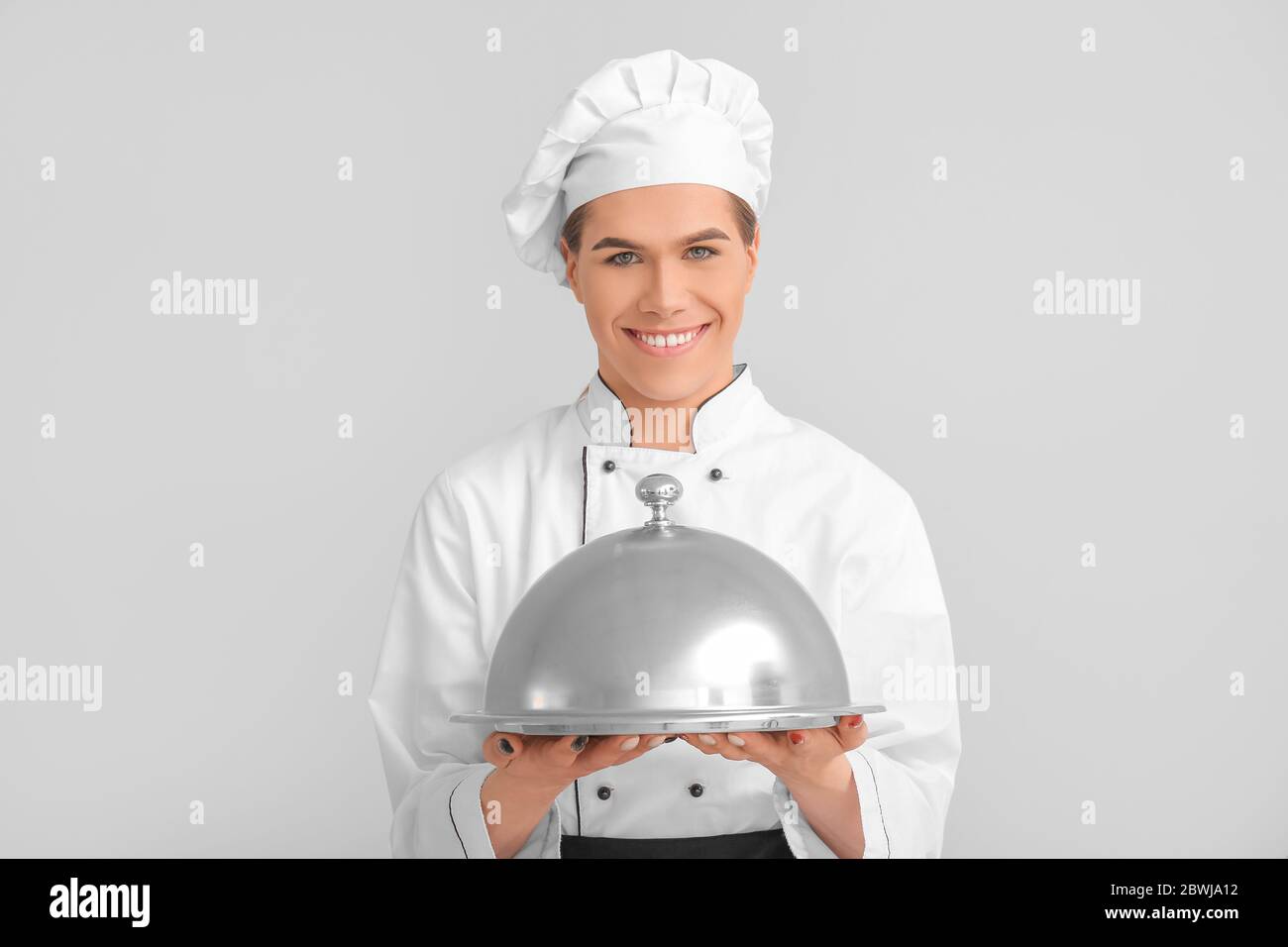 Transgender chef on light background Stock Photo - Alamy