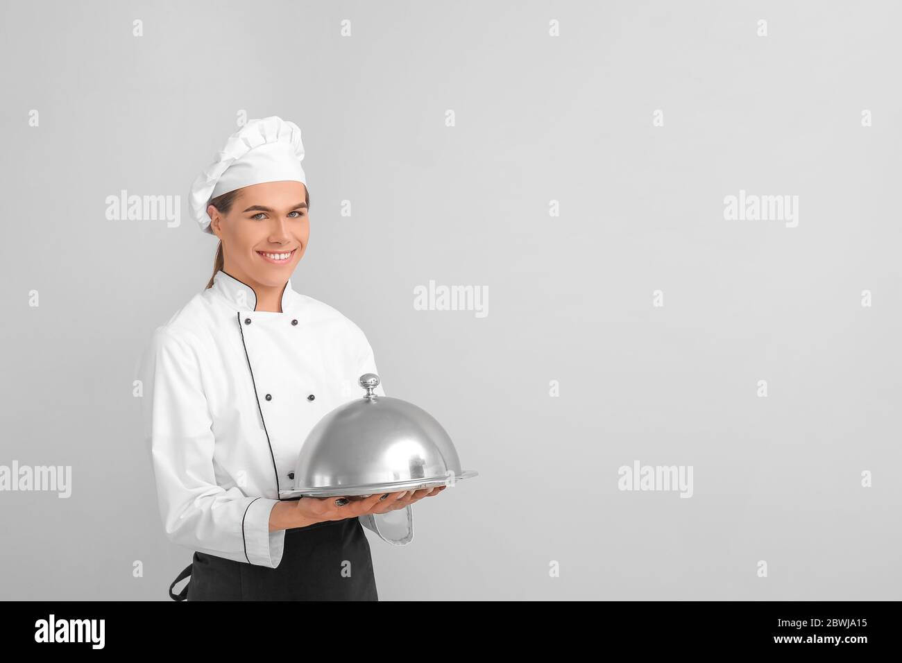Transgender chef on light background Stock Photo - Alamy
