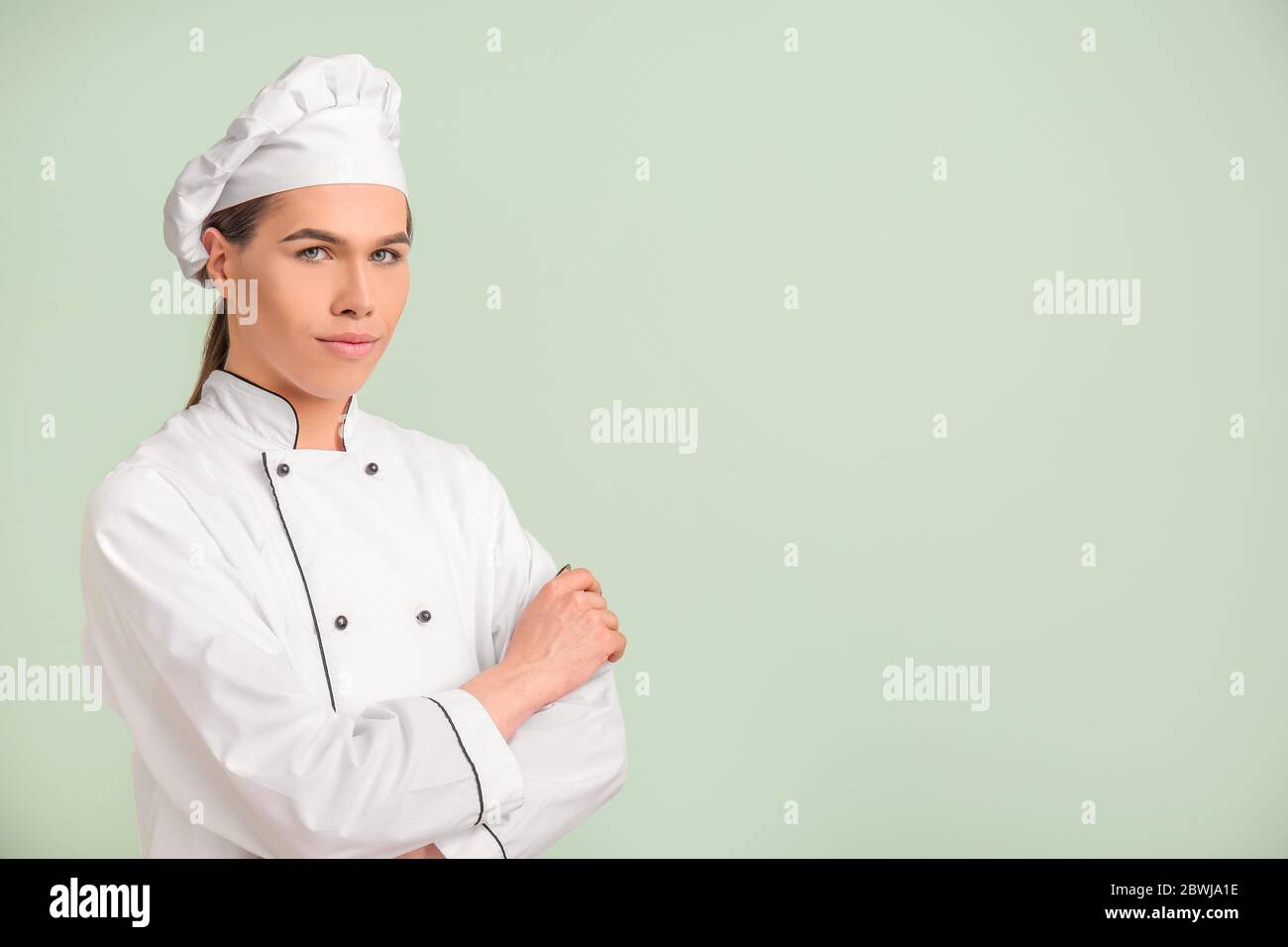 Transgender chef on color background Stock Photo - Alamy