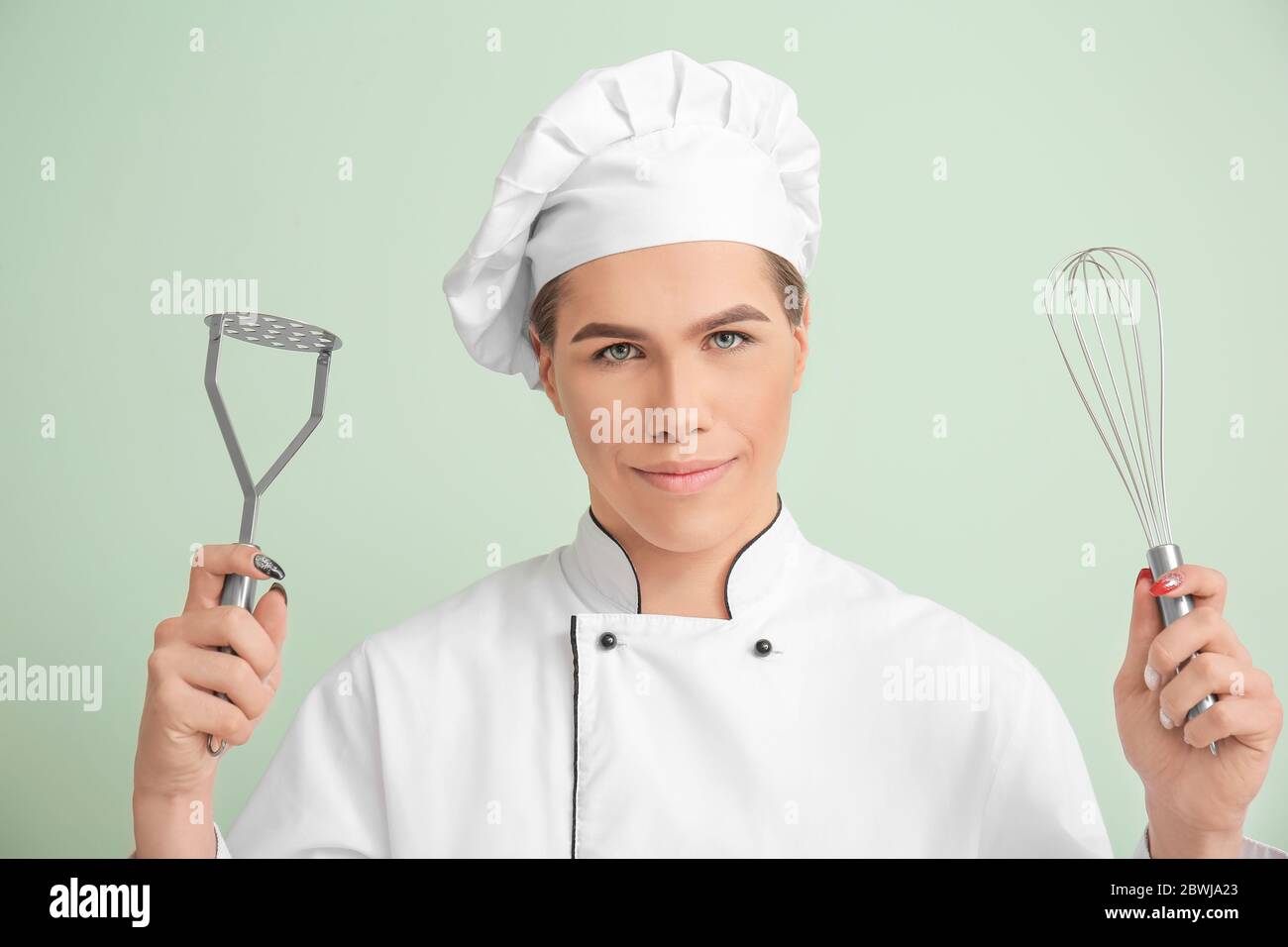 Transgender chef on color background Stock Photo - Alamy