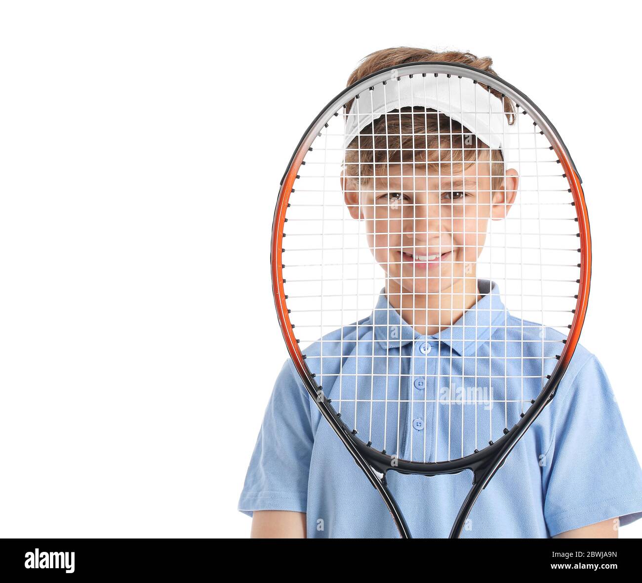 Cute little boy with tennis racket on white background Stock Photo - Alamy