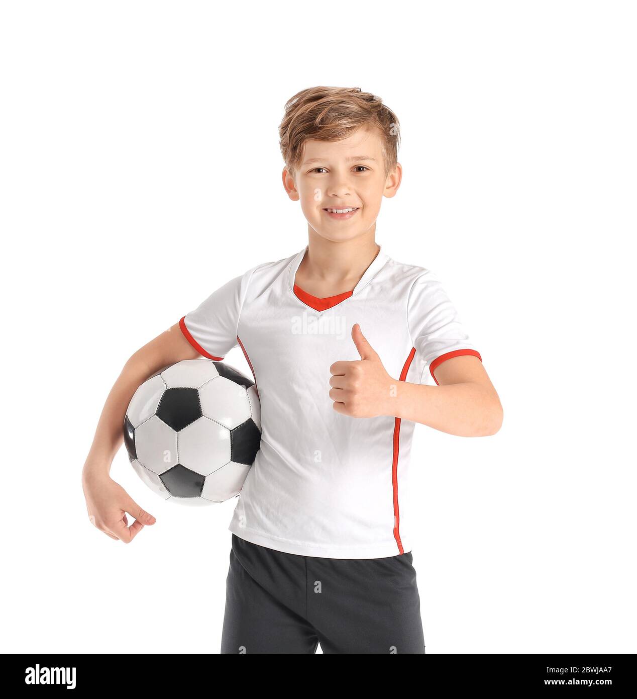 Cute little football player on white background Stock Photo - Alamy