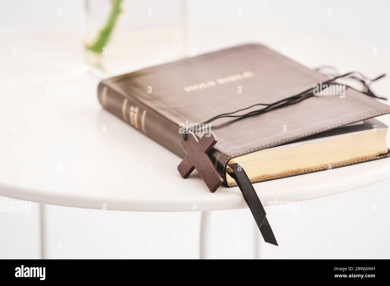 Holy Bible on table in room Stock Photo - Alamy