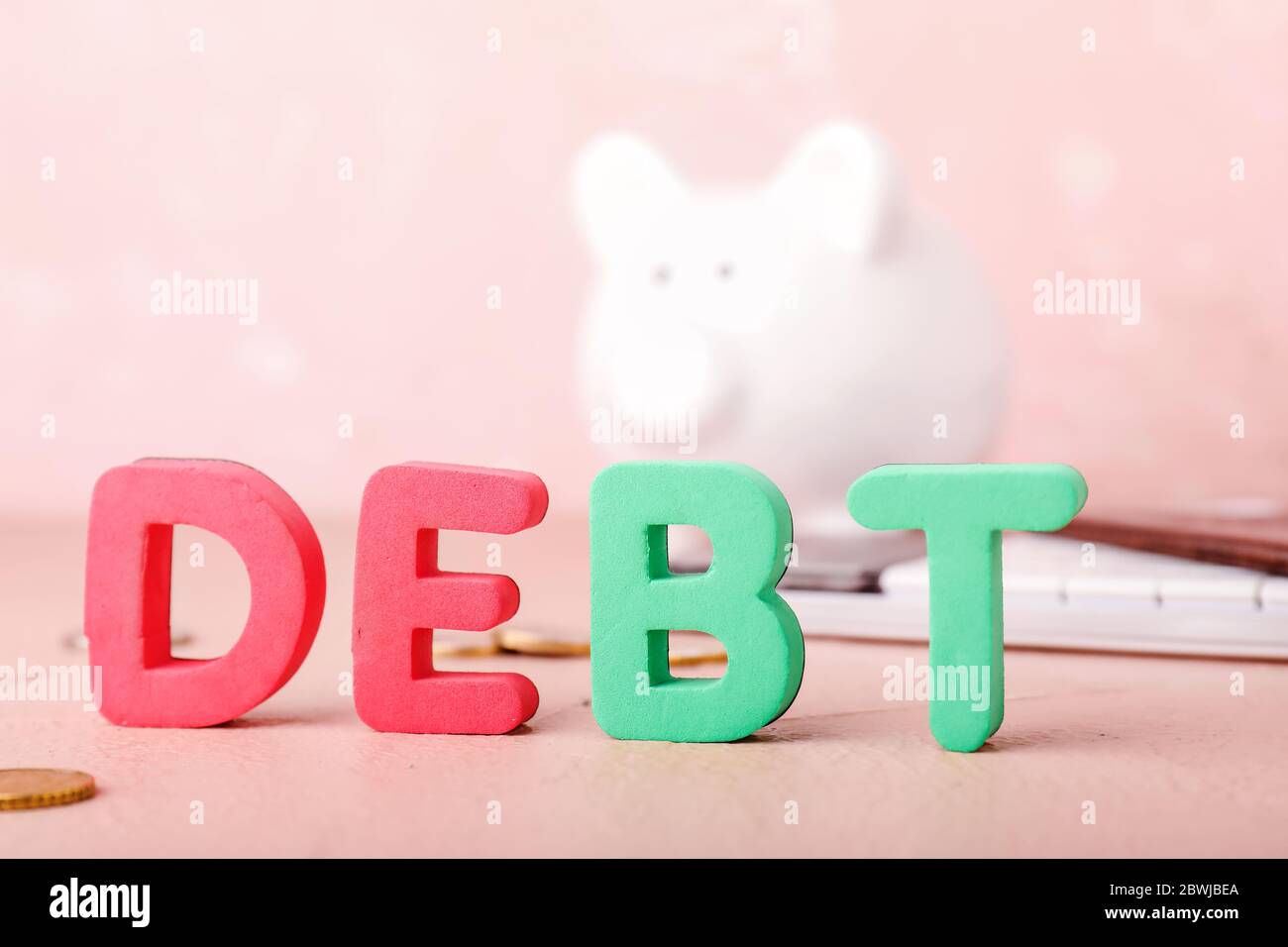 Word DEBT on color table Stock Photo - Alamy