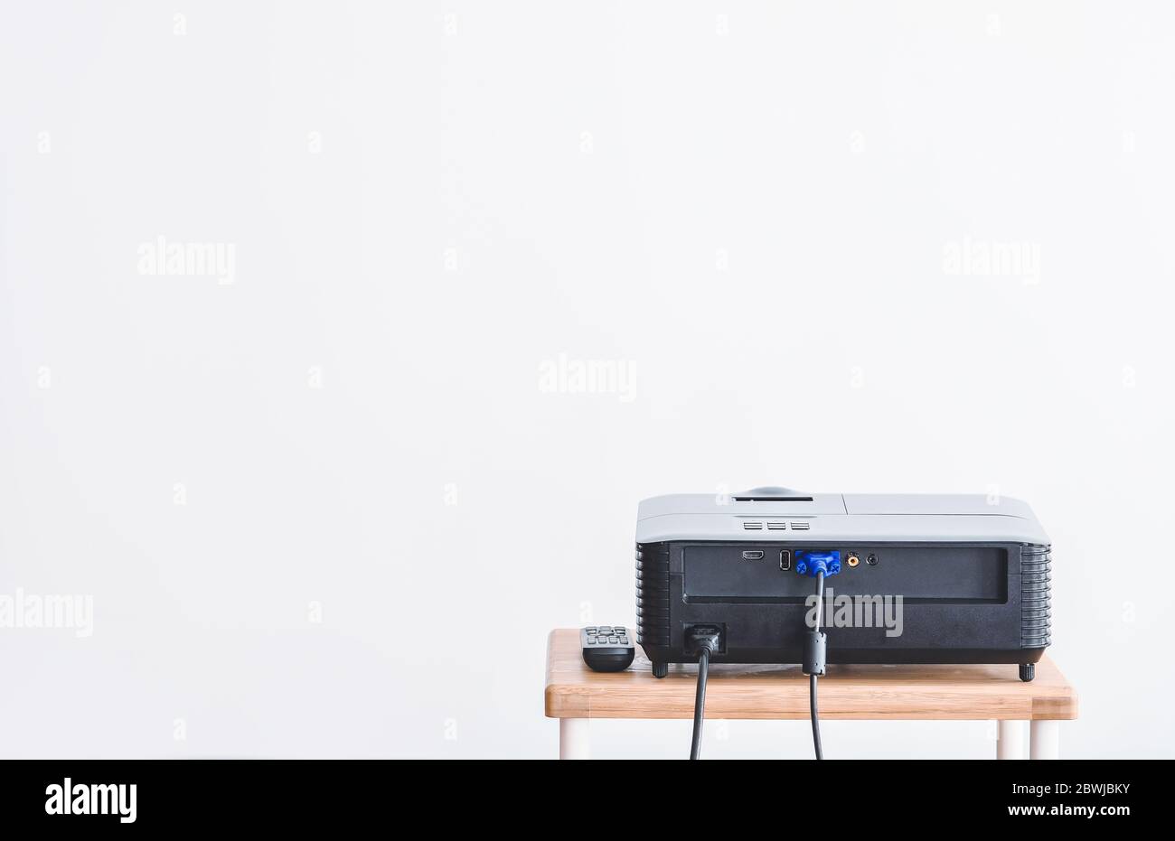 Modern video projector on table against white background Stock Photo ...