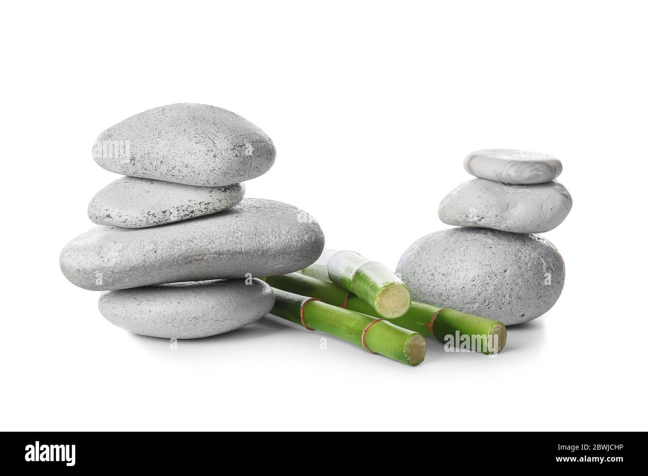 Zen stones and bamboo on white background Stock Photo - Alamy