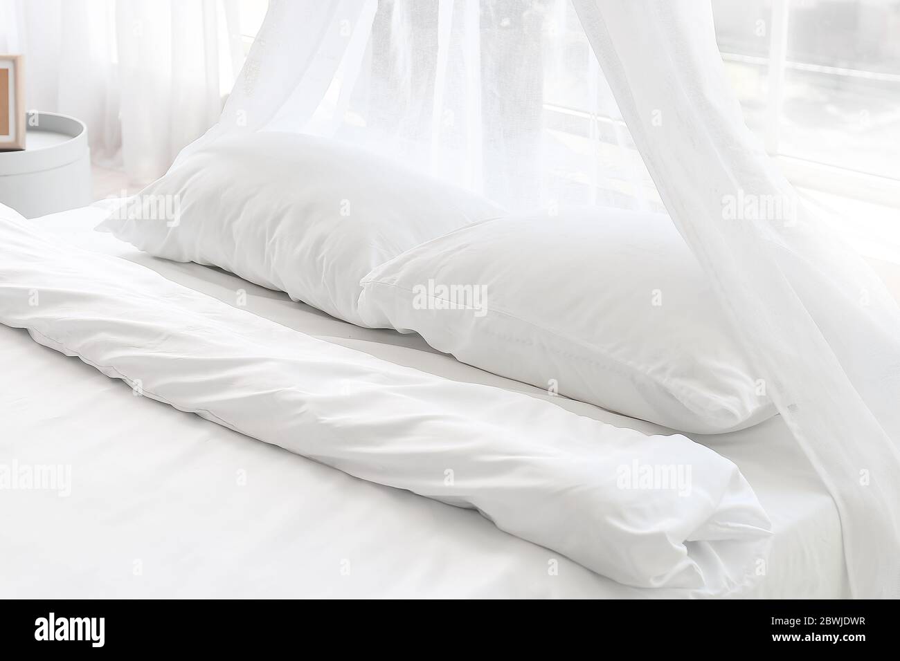 Soft white linen on bed Stock Photo - Alamy