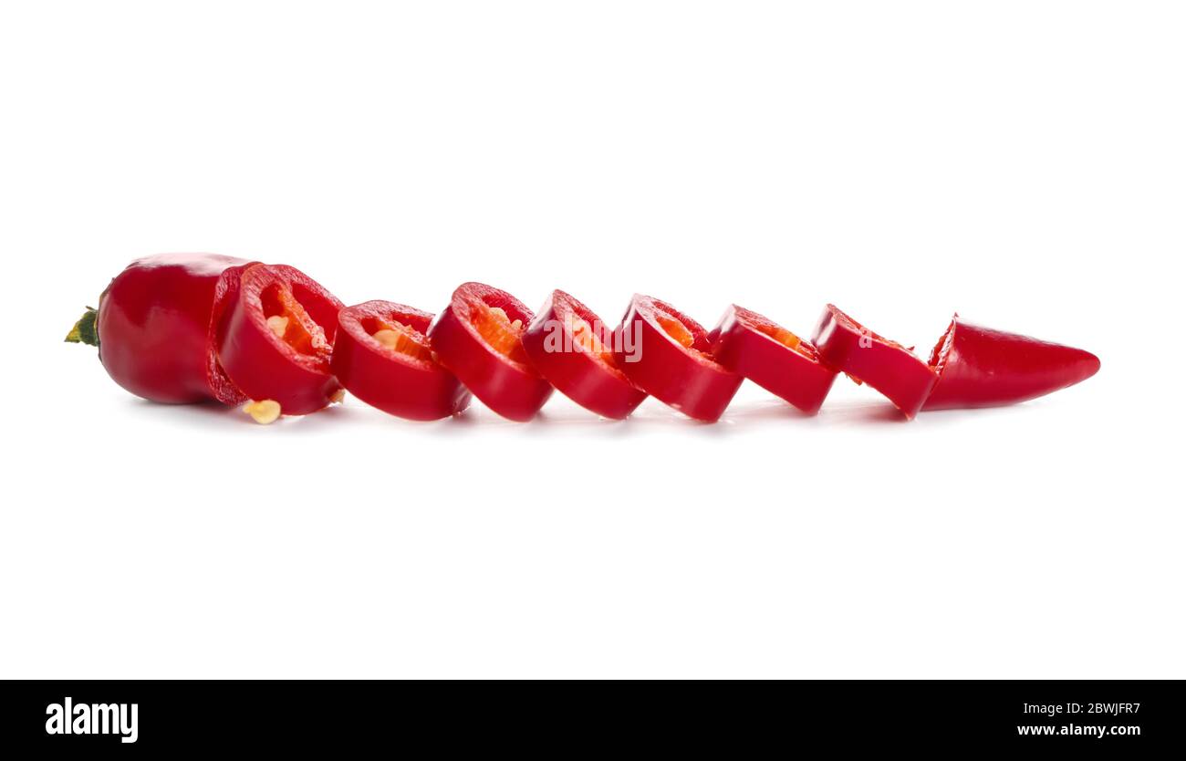 Cut chili pepper on white background Stock Photo - Alamy