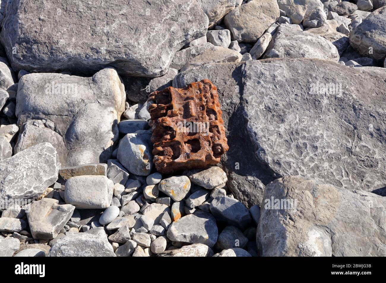 An old small car engine washed up onto the rocks at this well known ...