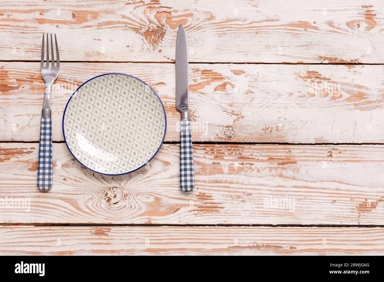 Simple table setting on wooden background Stock Photo - Alamy