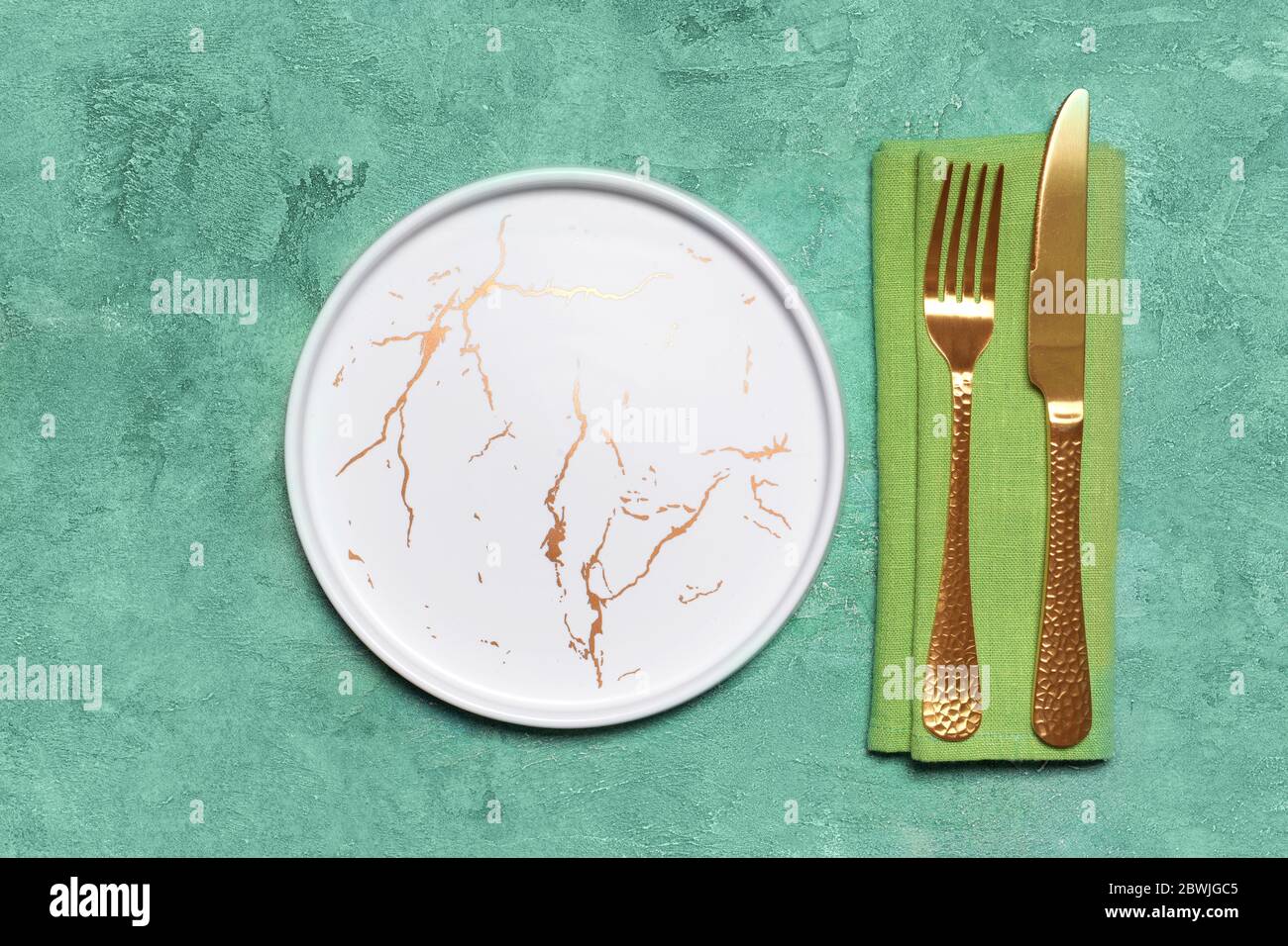 Simple table setting on color background Stock Photo - Alamy
