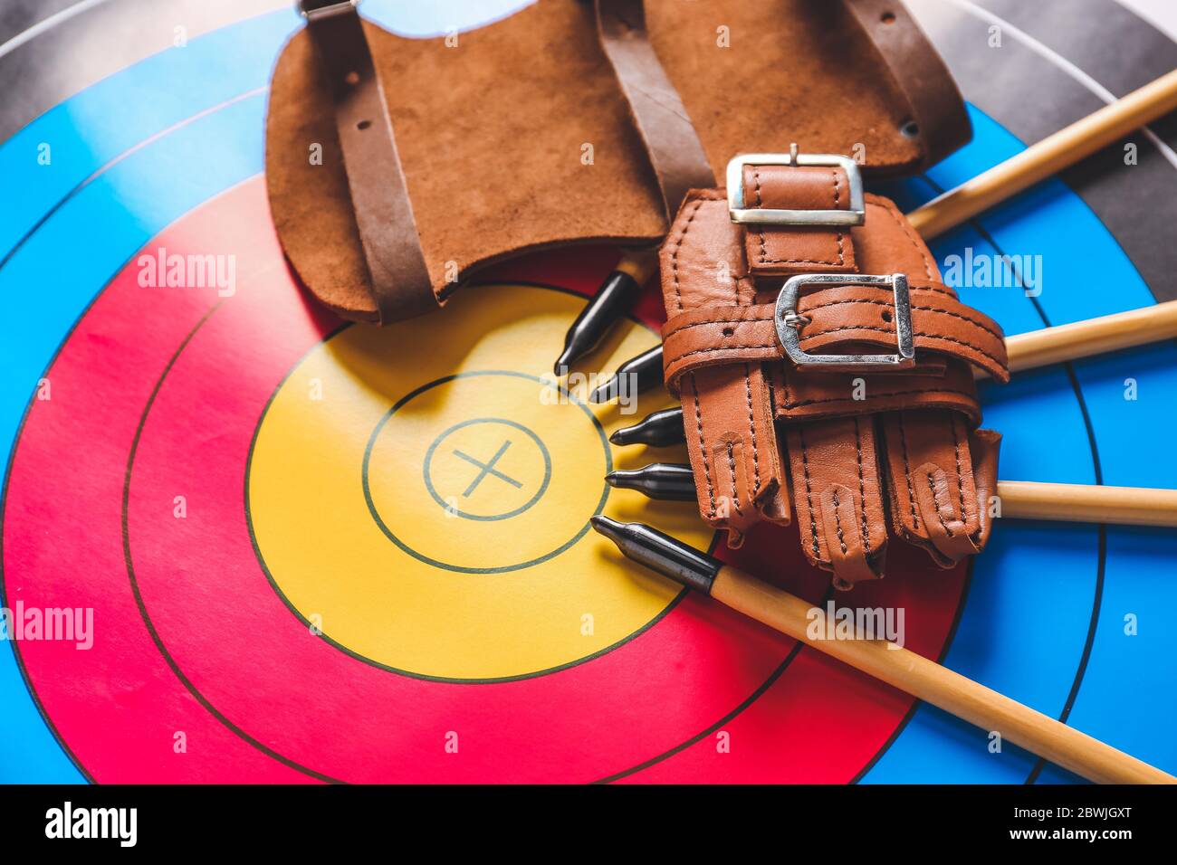 Arrows and protective equipment for archery on target Stock Photo - Alamy