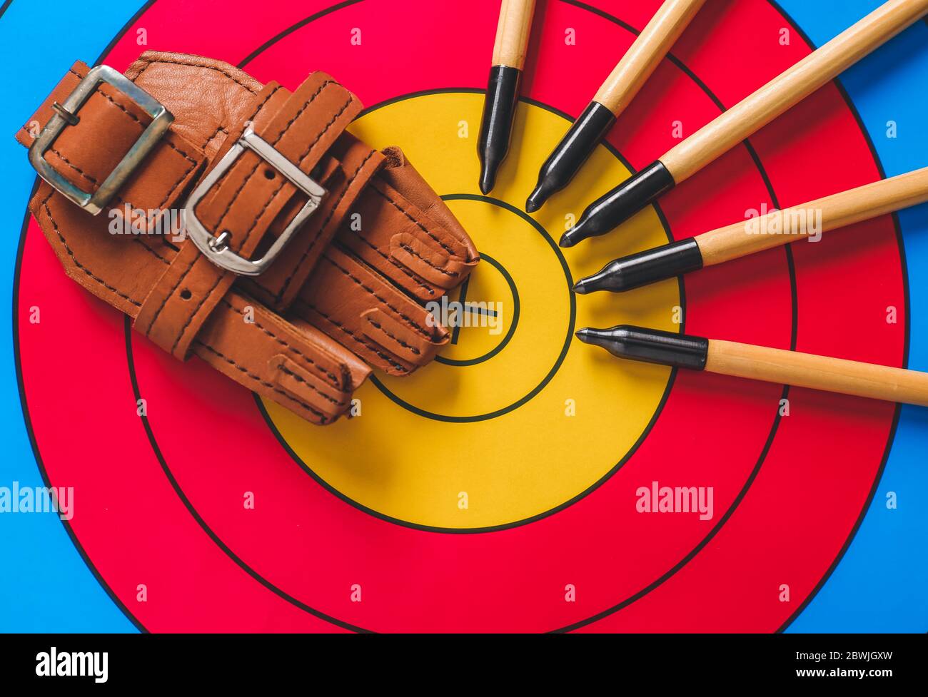 Arrows and protective equipment for archery on target Stock Photo - Alamy