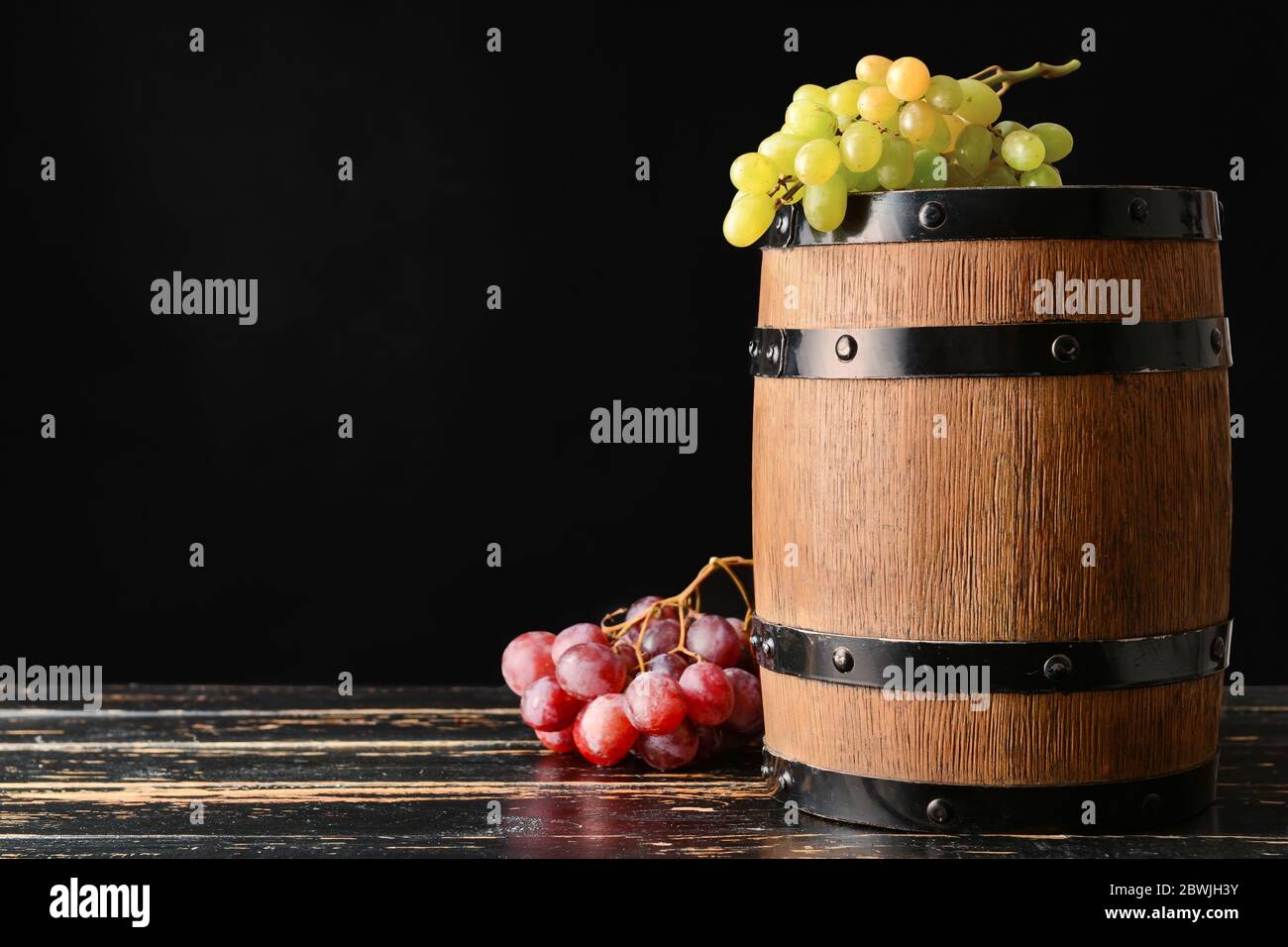 Wooden barrel of wine on dark background Stock Photo - Alamy