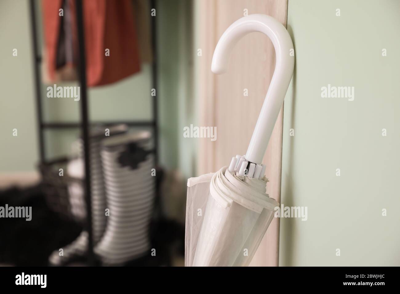 Stylish umbrella in interior of hall Stock Photo - Alamy