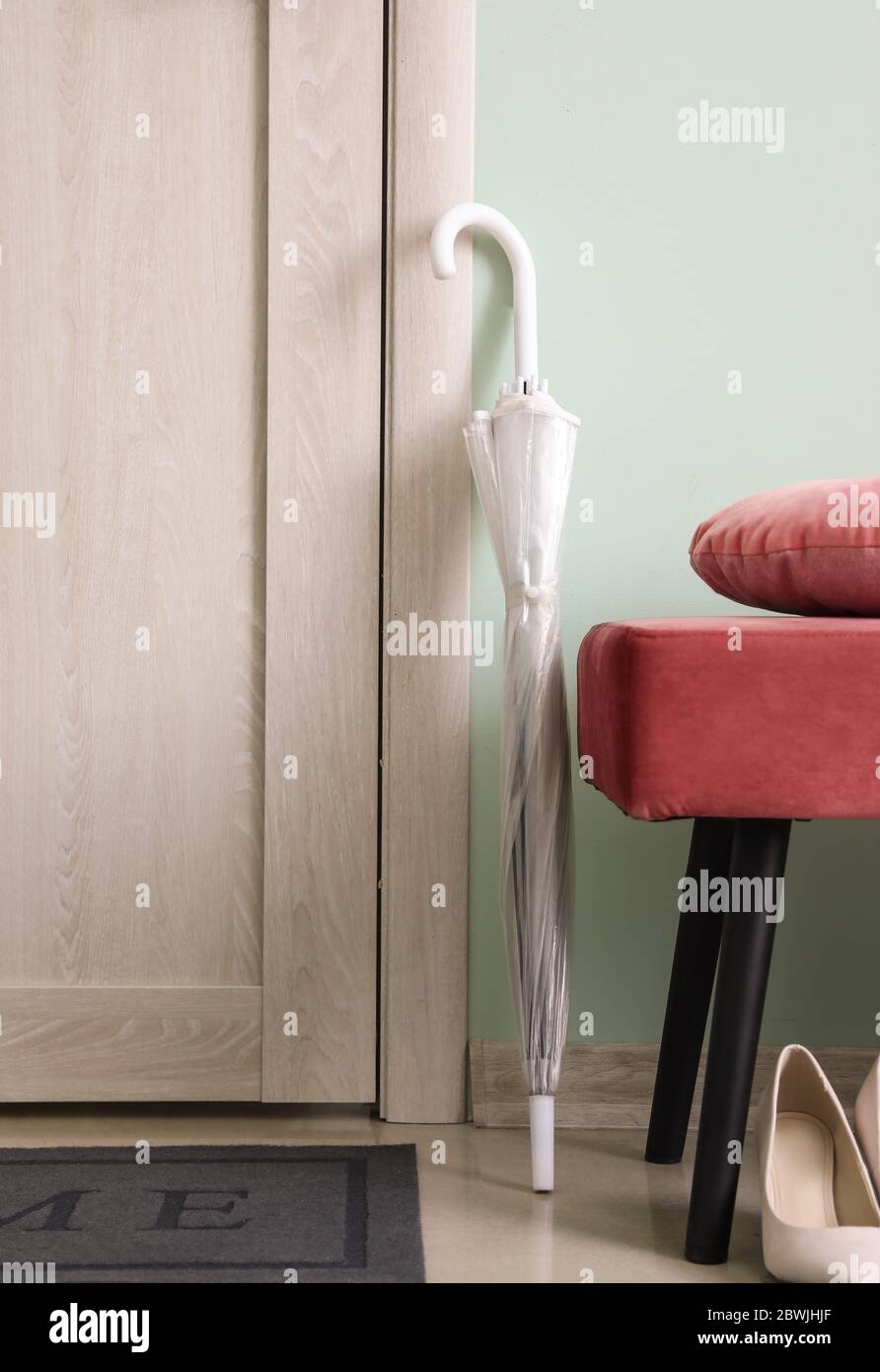 Stylish umbrella in interior of hall Stock Photo - Alamy