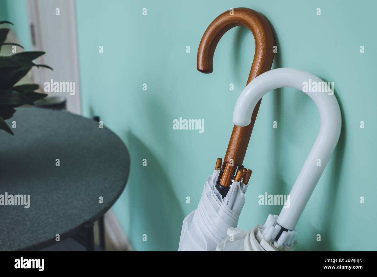 Stylish umbrellas in interior of hall Stock Photo - Alamy