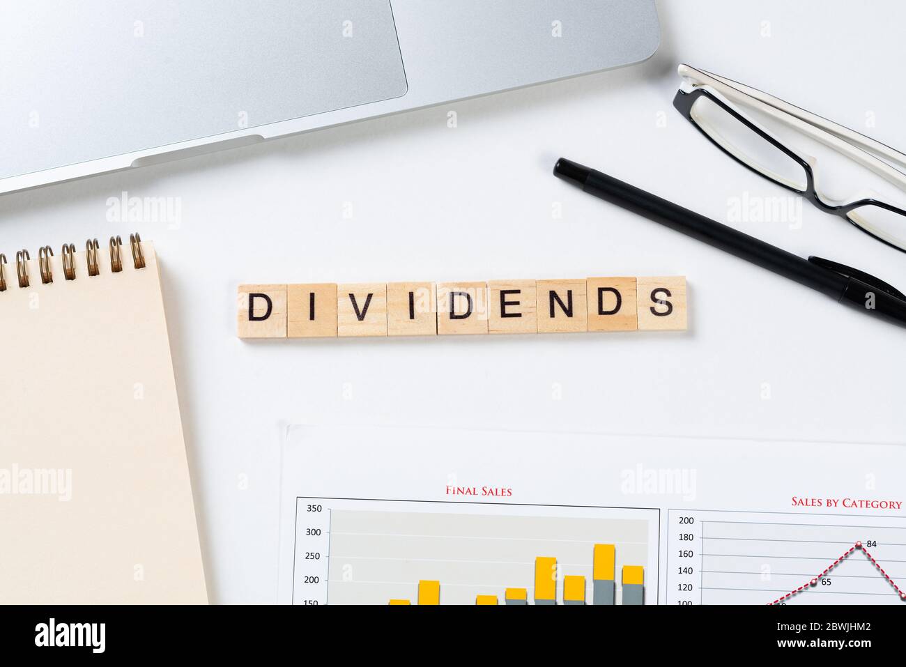 Dividends payment concept with letters Stock Photo - Alamy