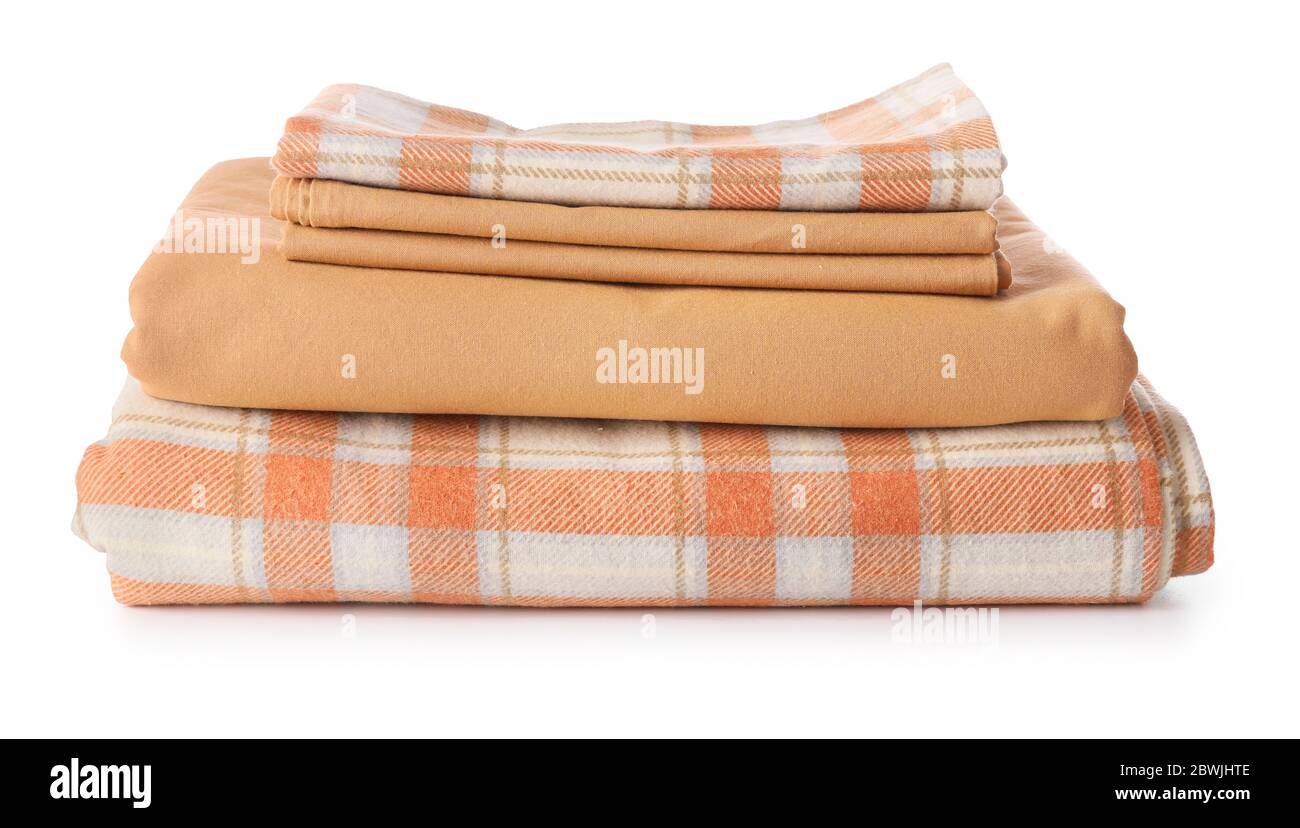 Stack of clean bed sheets on white background Stock Photo - Alamy