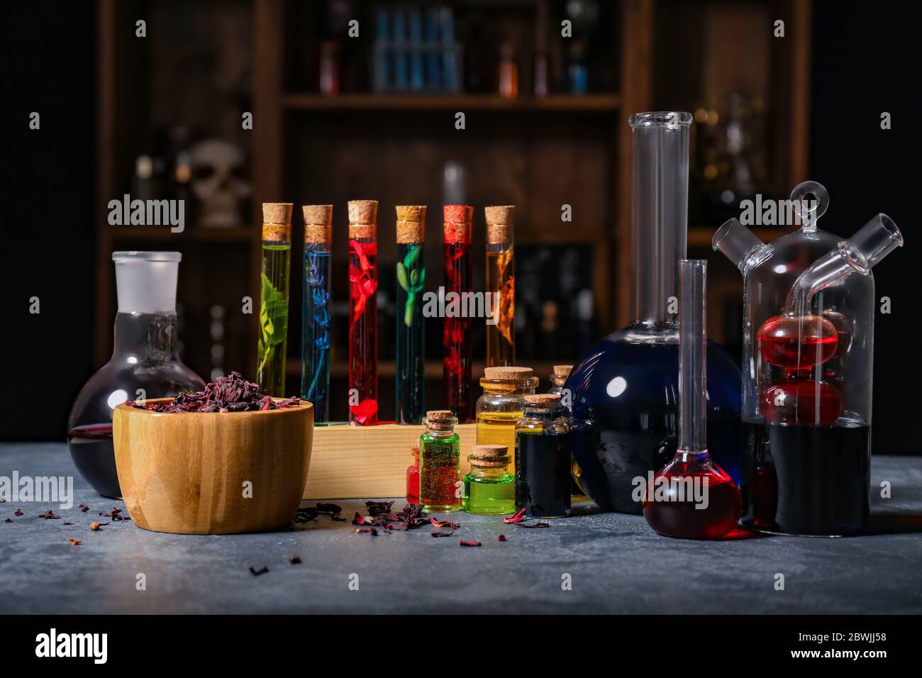 Different potions on table in alchemist's laboratory Stock Photo - Alamy