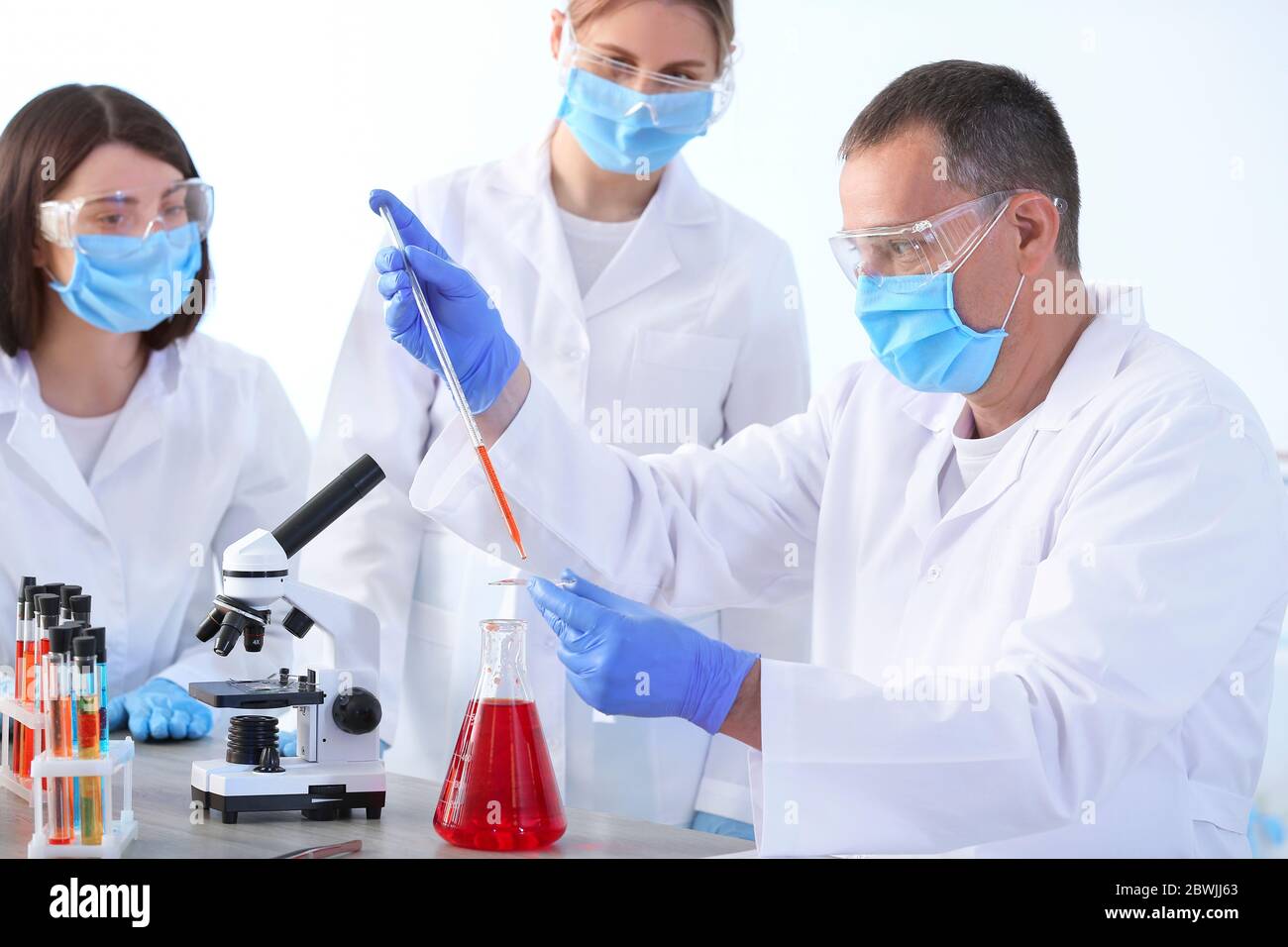 Scientists working in modern laboratory Stock Photo - Alamy