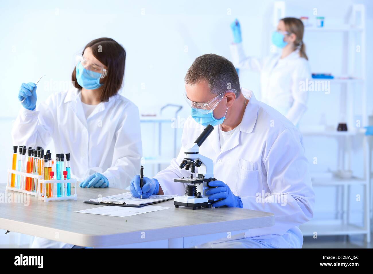 Scientists working in the laboratory hi-res stock photography and ...