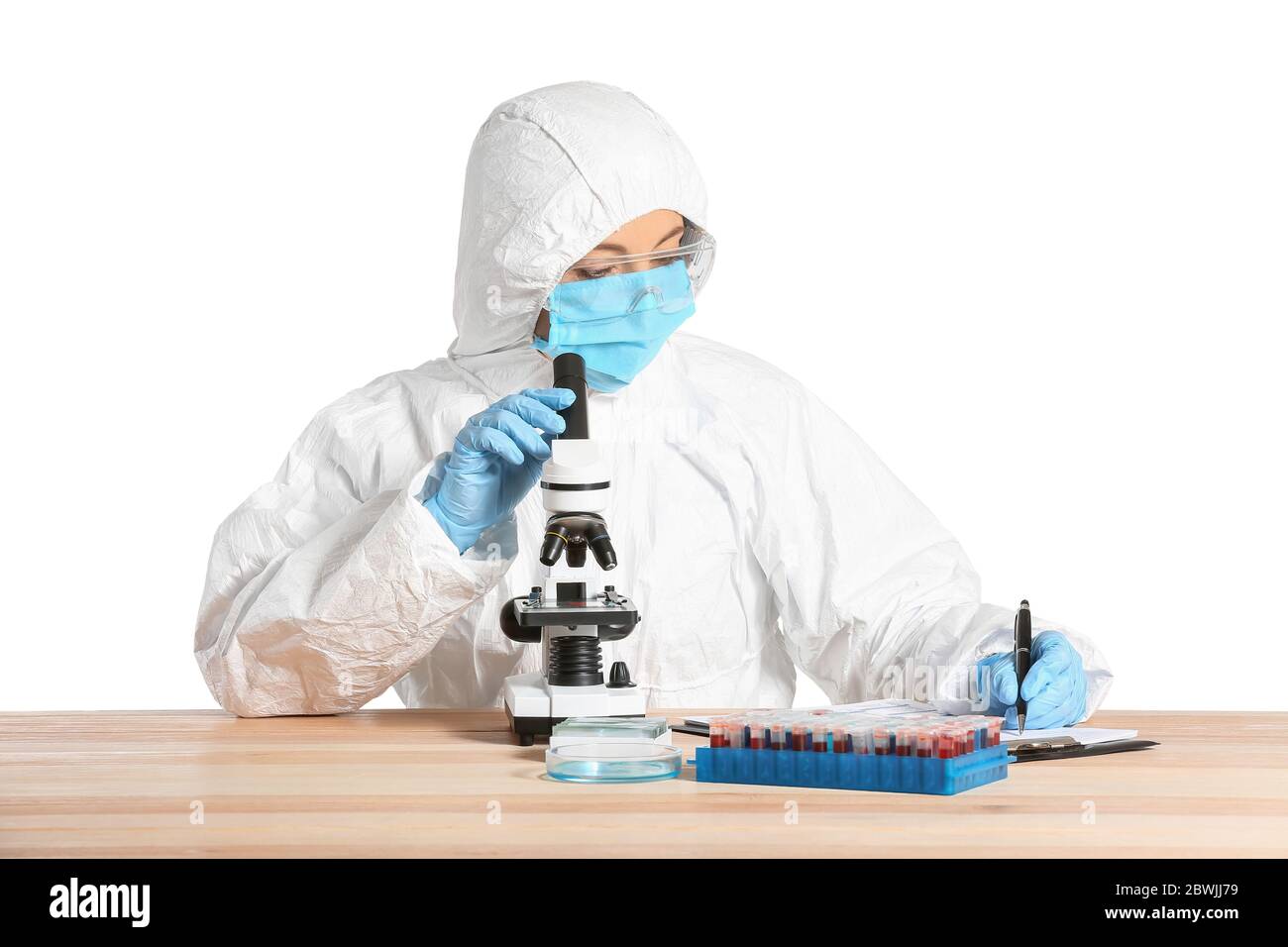Scientist working with microscope against white background Stock Photo ...