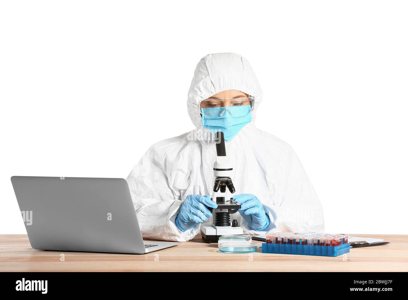 Scientist working with microscope against white background Stock Photo ...