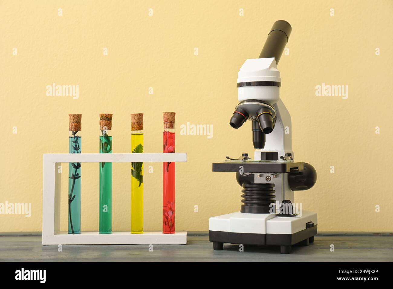 Modern microscope and test tubes on table Stock Photo - Alamy