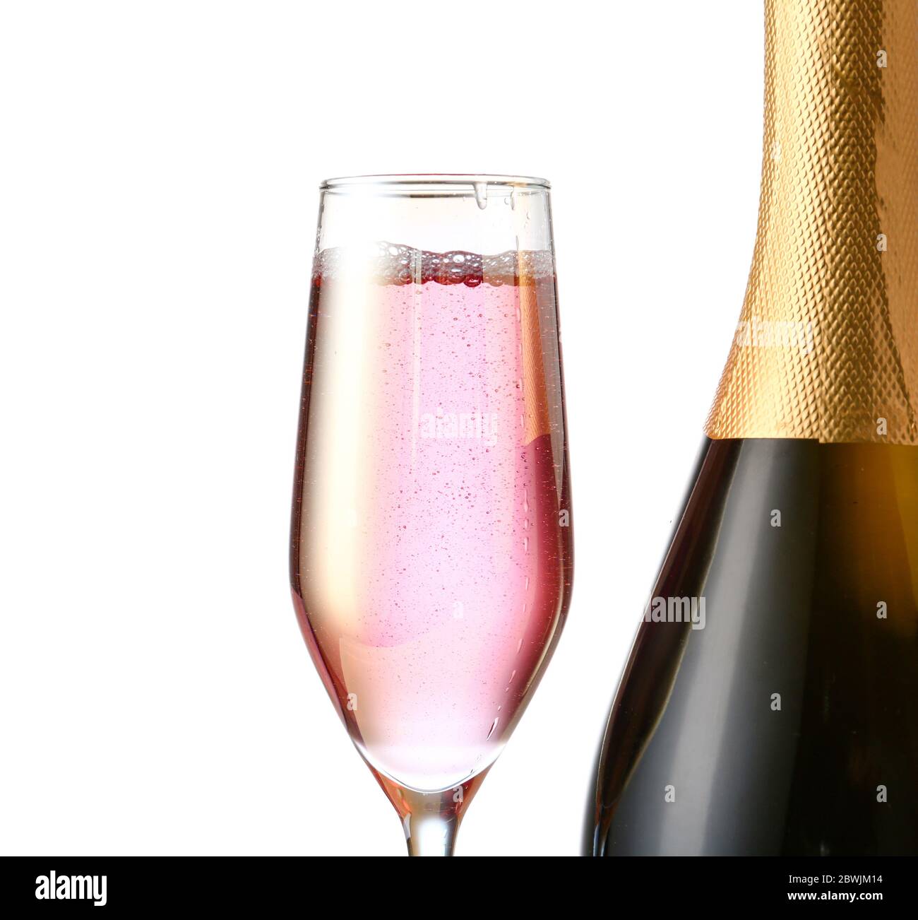 Bottle of tasty champagne and glass on white background Stock Photo - Alamy