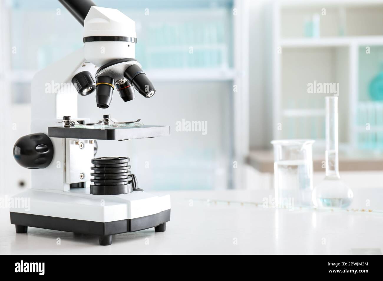 Modern microscope on table in laboratory Stock Photo - Alamy