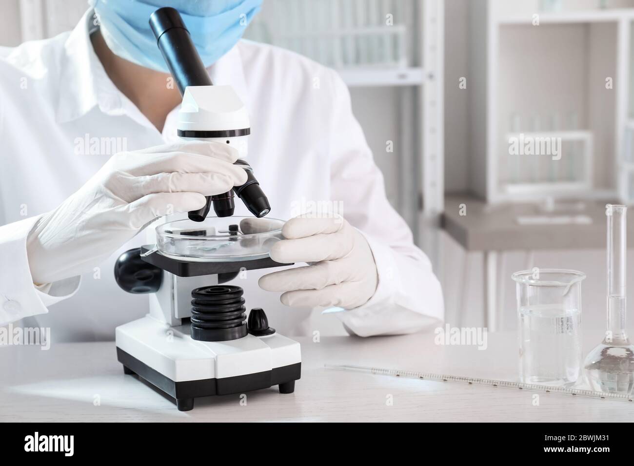 Female scientist using microscope table hi-res stock photography and ...