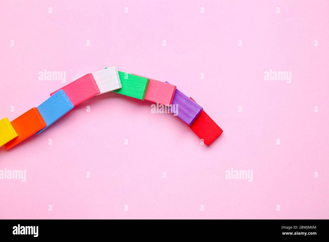 Colorful wooden blocks on pink background. Unity concept Stock Photo ...