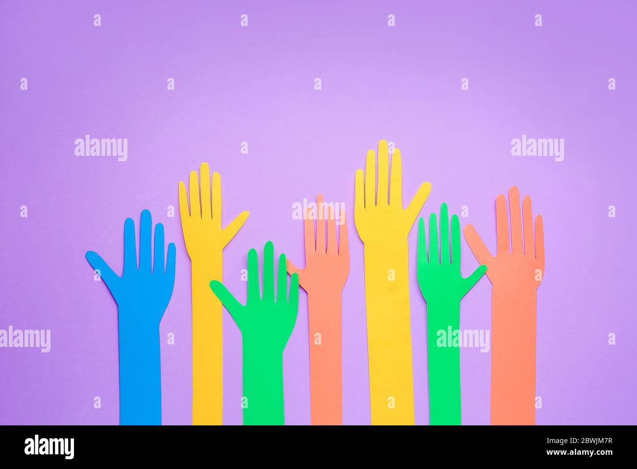 Paper human hands on color background. Unity concept Stock Photo - Alamy