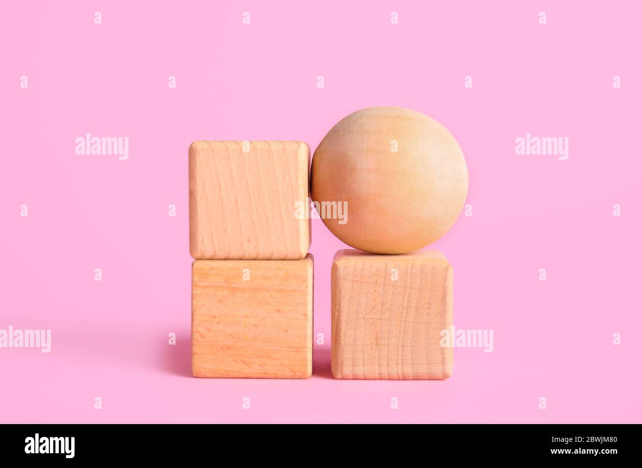 Wooden cubes and sphere on color background. Unity concept Stock Photo ...