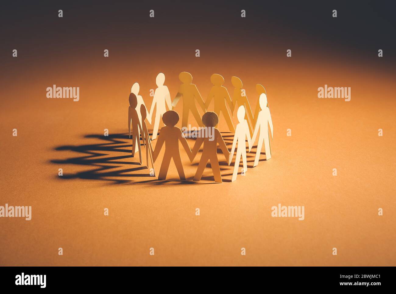 Circle made of paper human figures on table. Unity concept Stock Photo ...