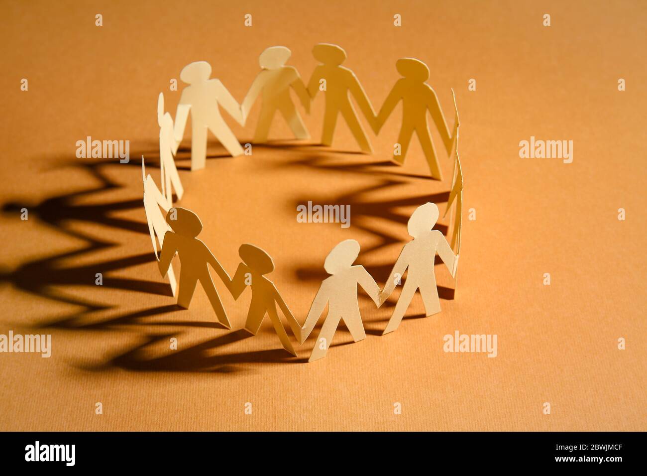 Circle made of paper human figures on table. Unity concept Stock Photo ...