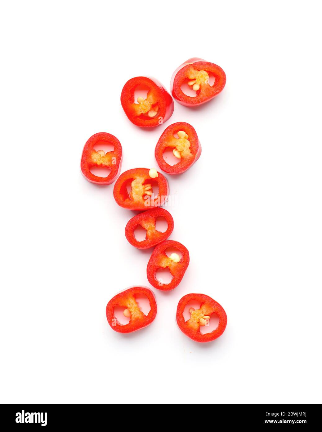 Cut chili pepper on white background Stock Photo - Alamy