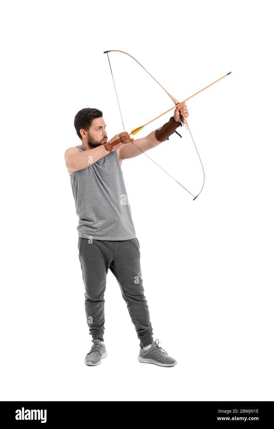 Handsome man with crossbow on white background Stock Photo - Alamy