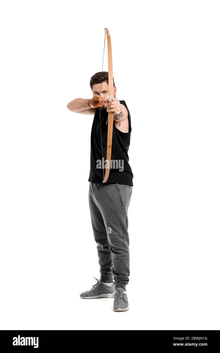 Handsome man with crossbow on white background Stock Photo - Alamy