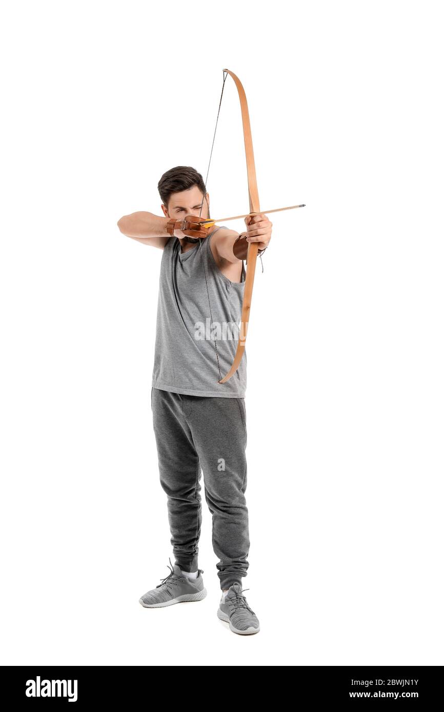 Handsome man with crossbow on white background Stock Photo - Alamy