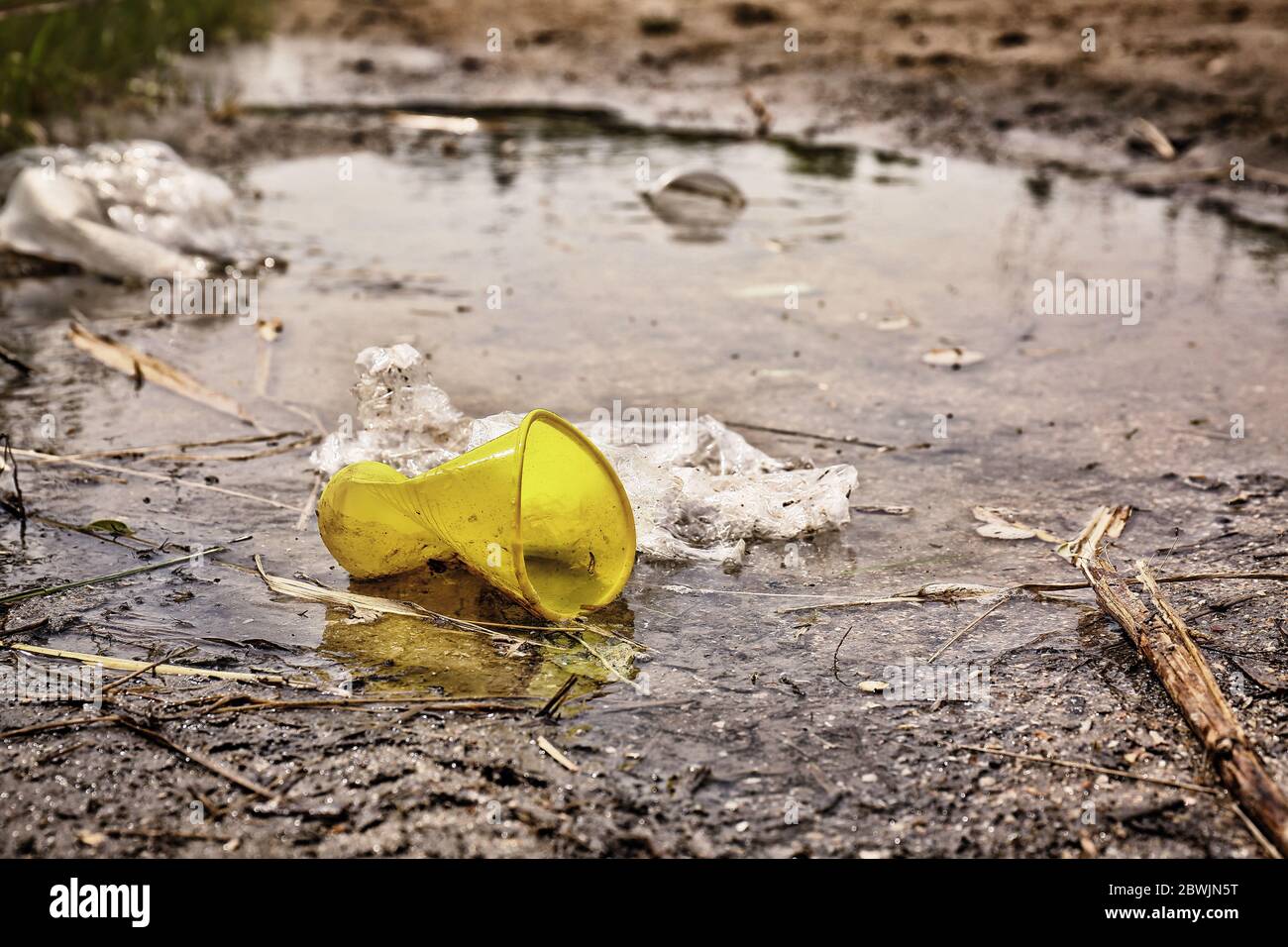 View of garbage near river outdoors. Concept of soil pollution Stock ...