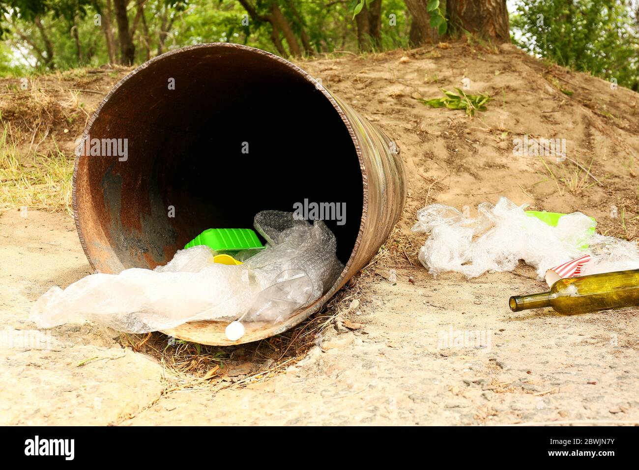 Sewer pipe with trash outdoors. Concept of soil pollution Stock Photo ...