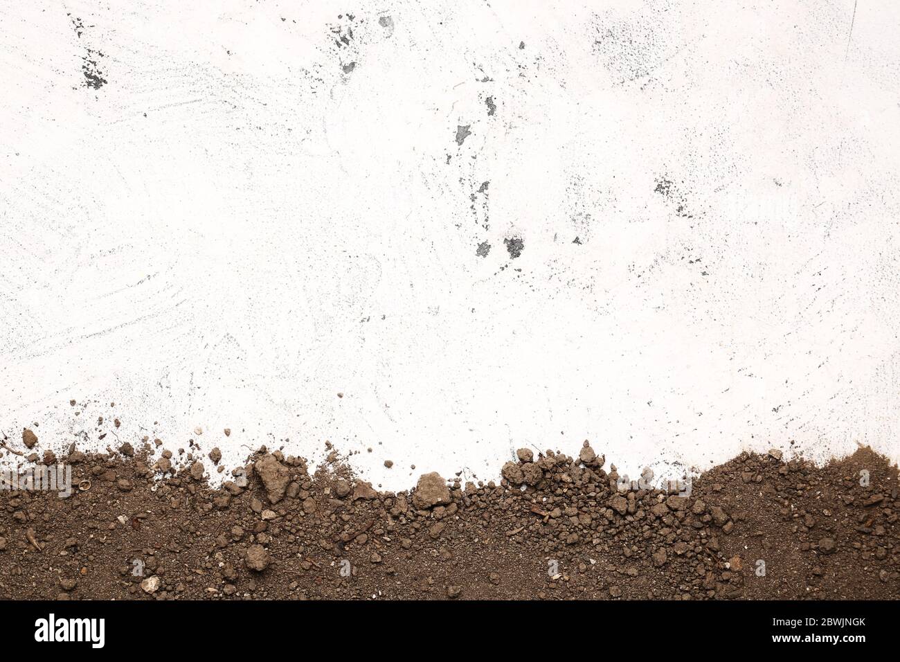 Scattered soil on light background Stock Photo - Alamy