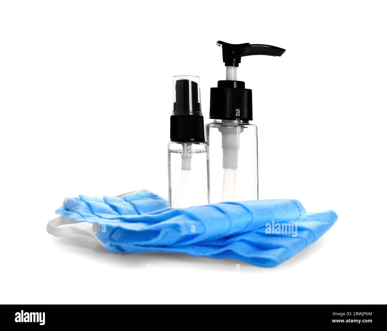 Disinfectants and medical mask on white background Stock Photo - Alamy