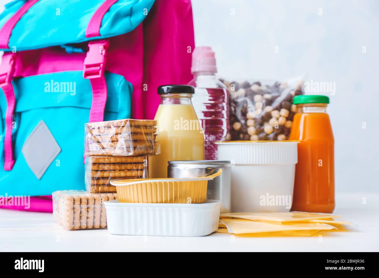 Schoolbag with different products on table. Concept of Backpack Food ...
